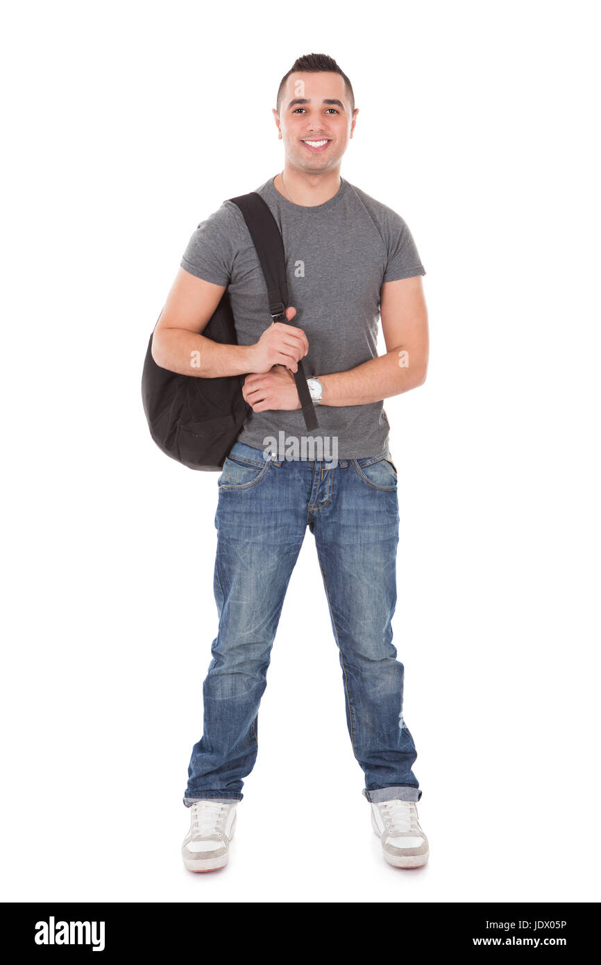 Full length portrait of confident male student carrying backpack ...