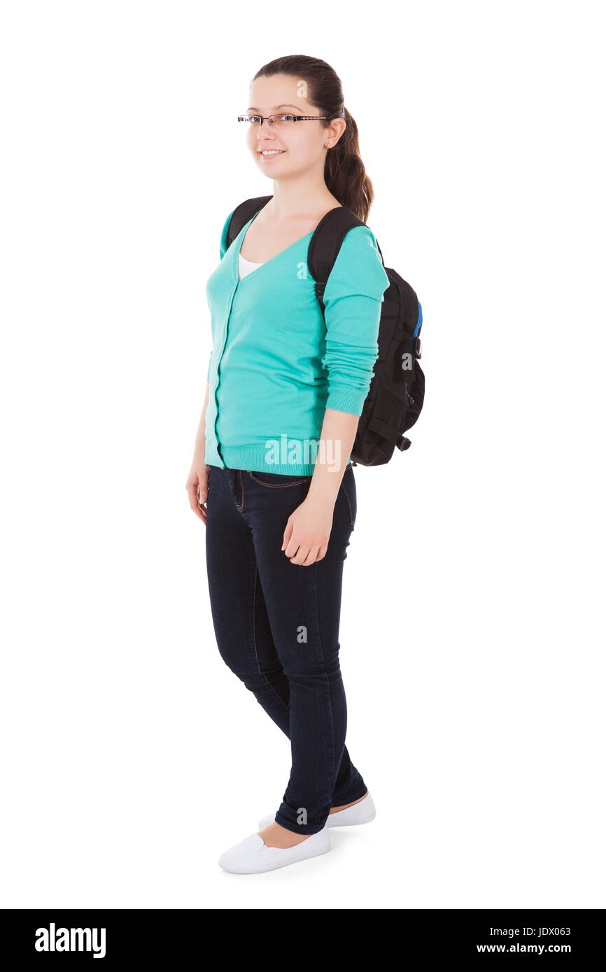 Full length portrait of confident female student standing against white ...