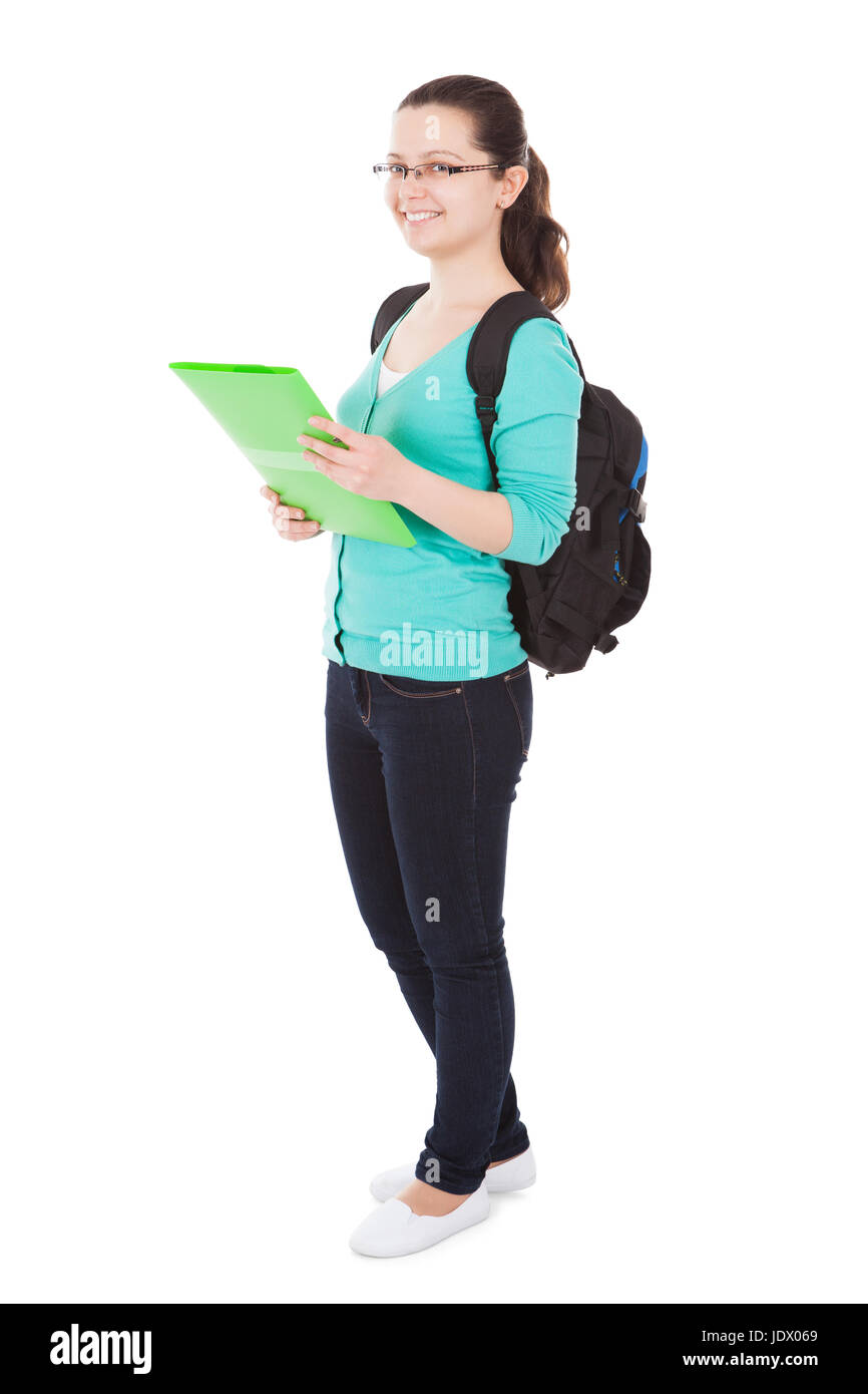 Full length portrait of confident female student standing against white ...