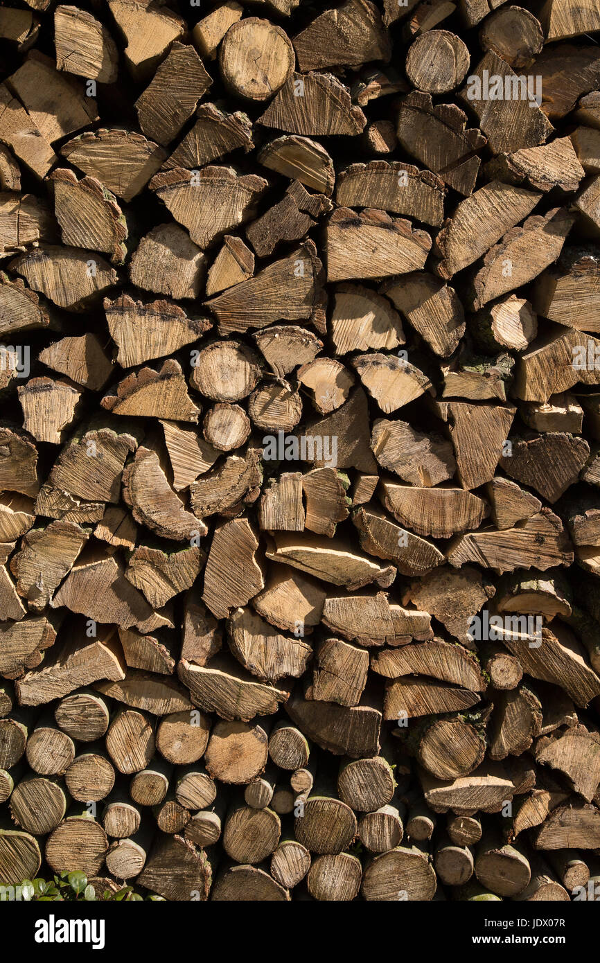Stack of logs for firewood Stock Photo - Alamy