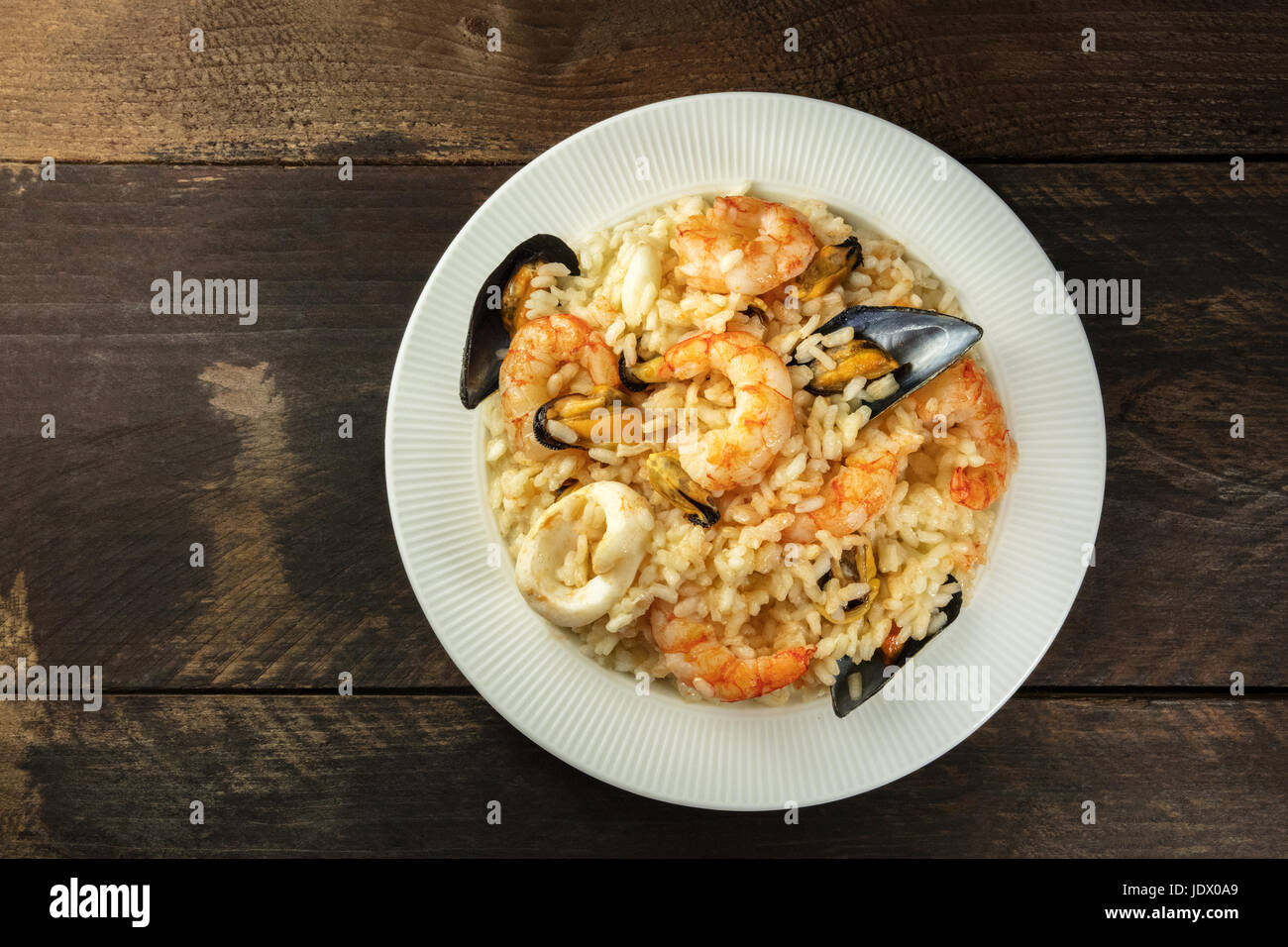 Seafood risotto on dark rustic background with copyspace Stock Photo ...