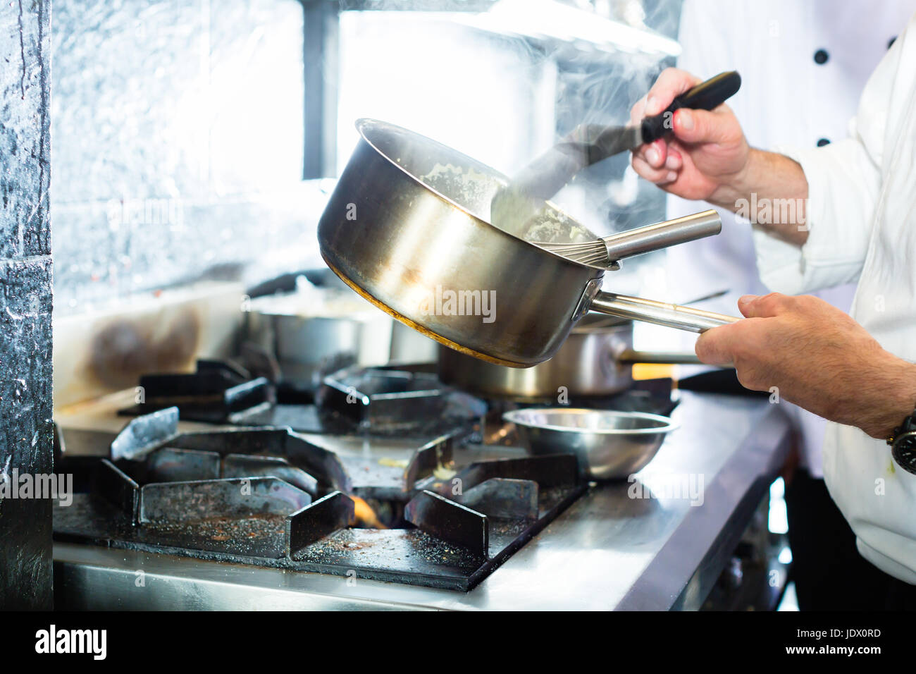 Close up hands chef stirring hi-res stock photography and images - Alamy