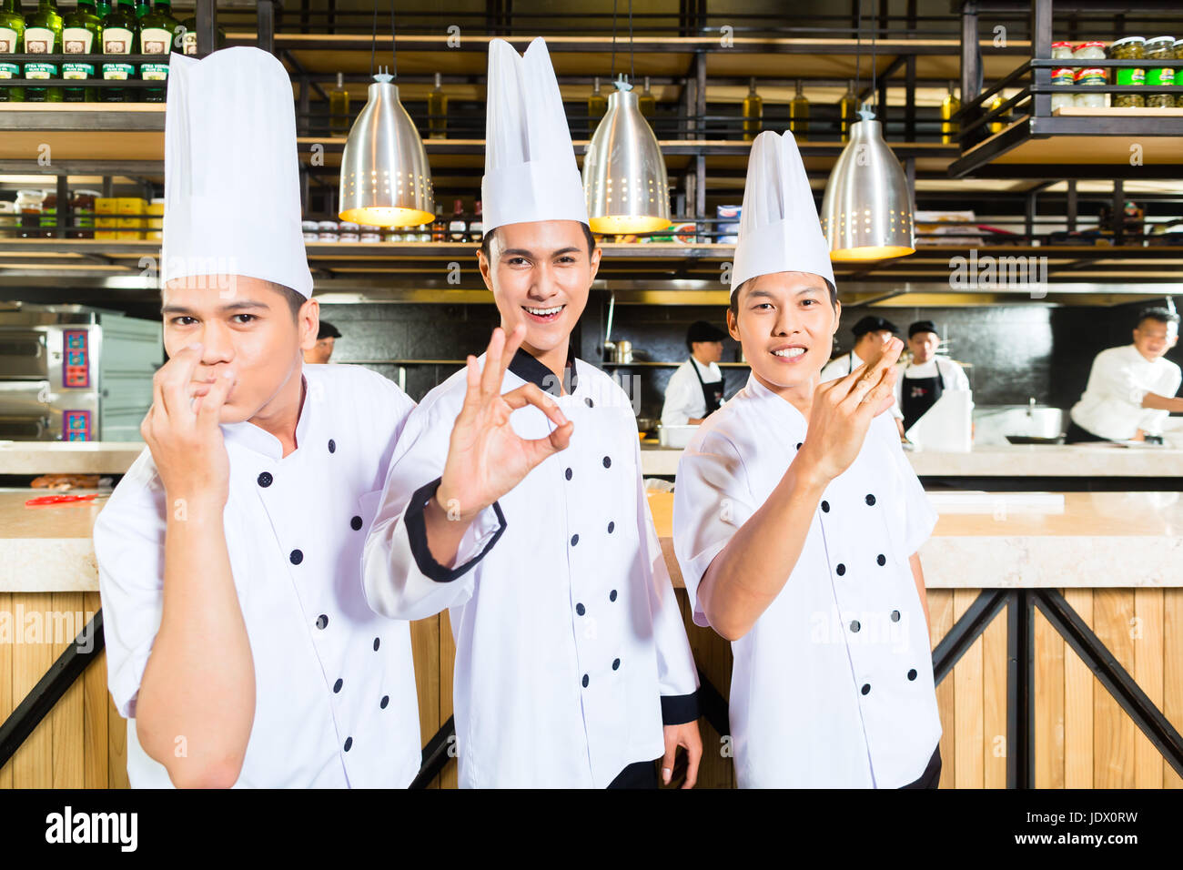 Portrait of three young chefs Stock Photo - Alamy