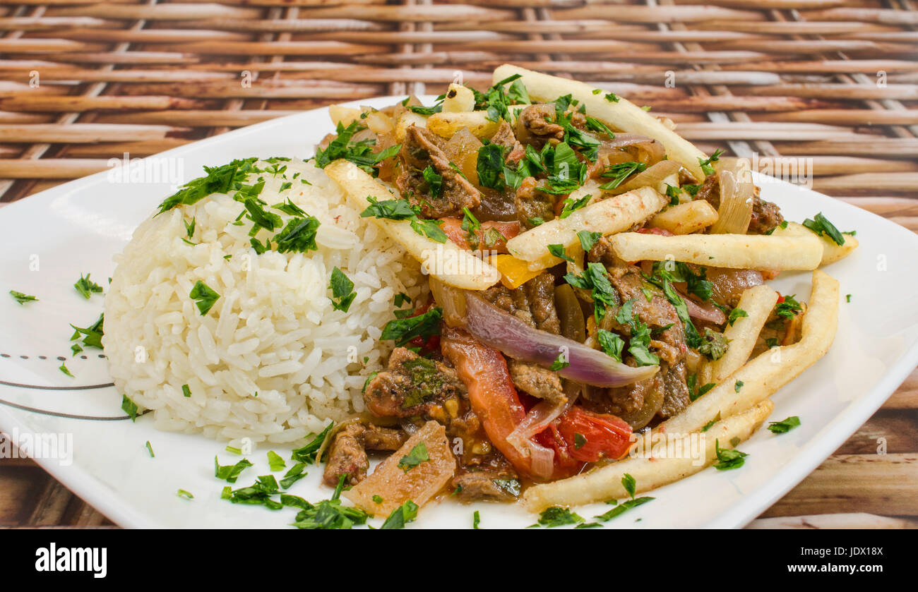 Lomo Saltado a Peruvian dish made with sautéed beef, tomatoes, onion ...