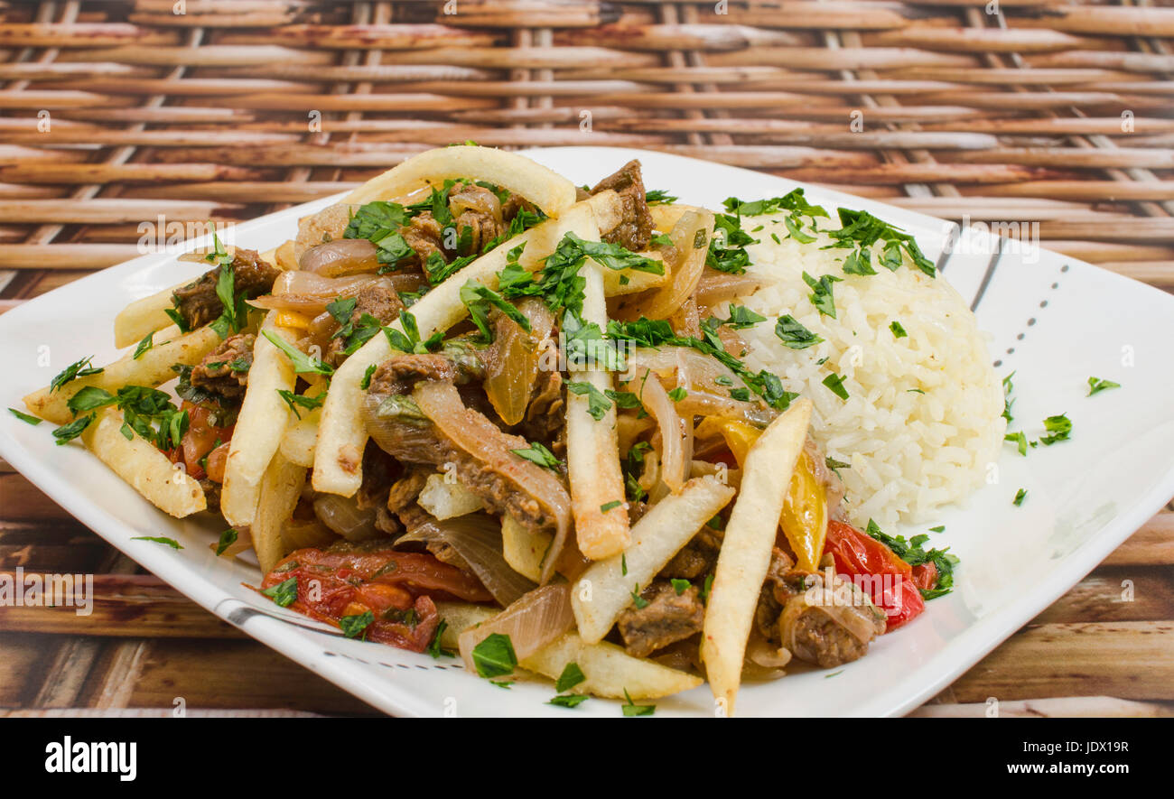 Lomo Saltado a Peruvian dish made with sautéed beef, tomatoes, onion ...