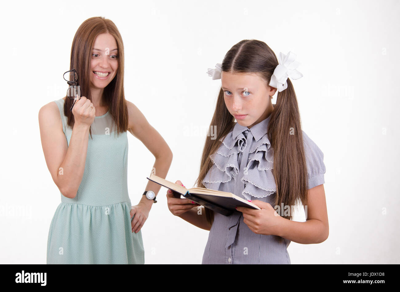 Teacher scolds the student responsible for the book Stock Photo - Alamy