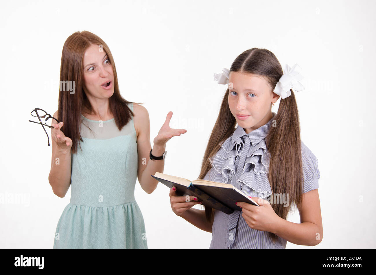 Teacher scolds the student responsible for the book Stock Photo - Alamy