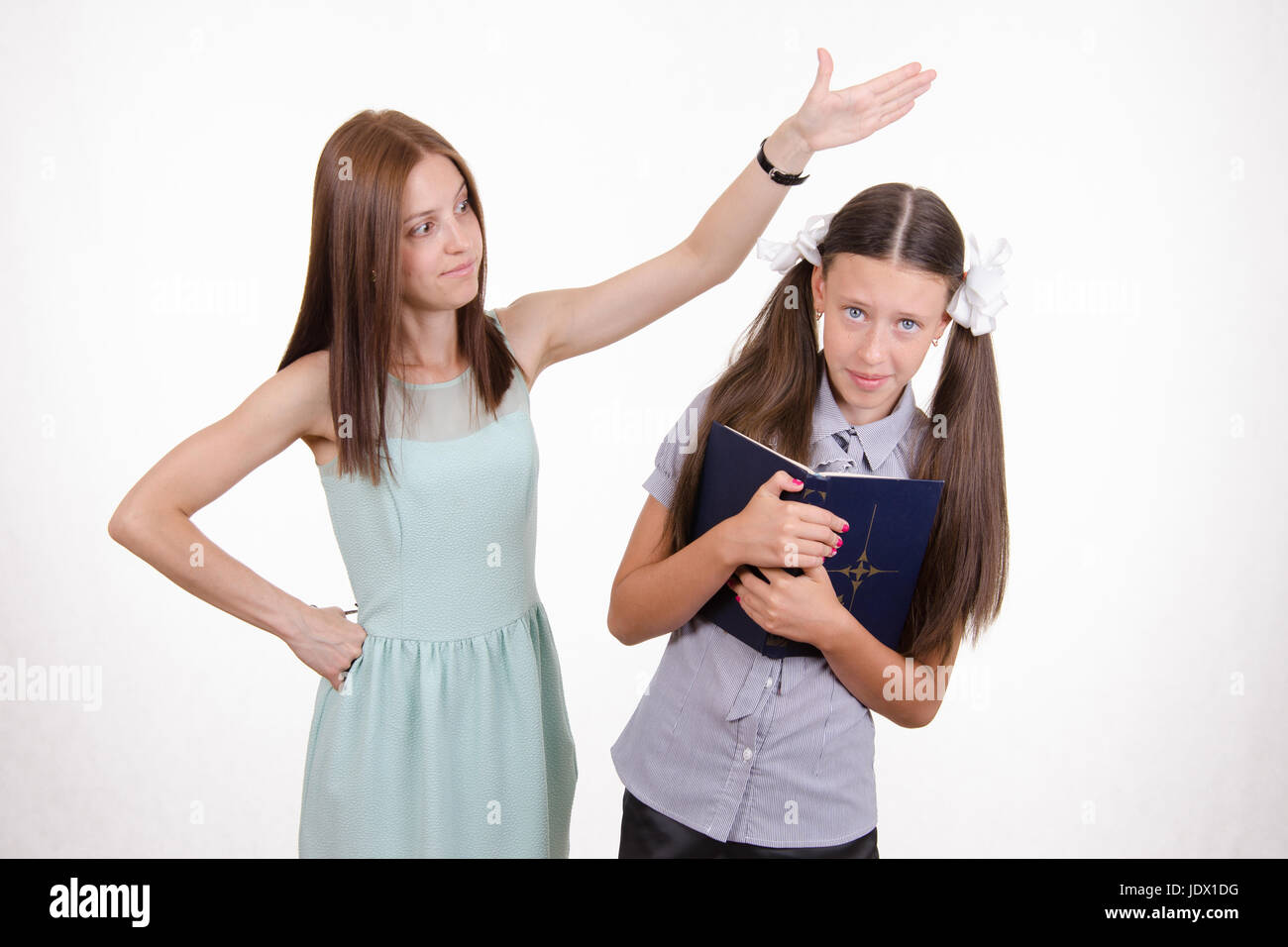 Teacher bangs his hand on the head and scolds student Stock Photo - Alamy
