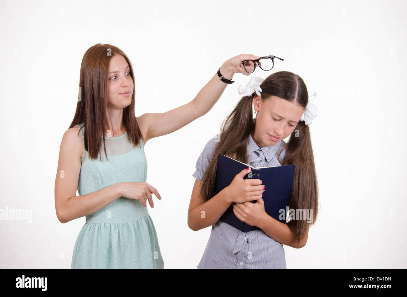Teacher bangs his hand on the head and scolds student Stock Photo - Alamy