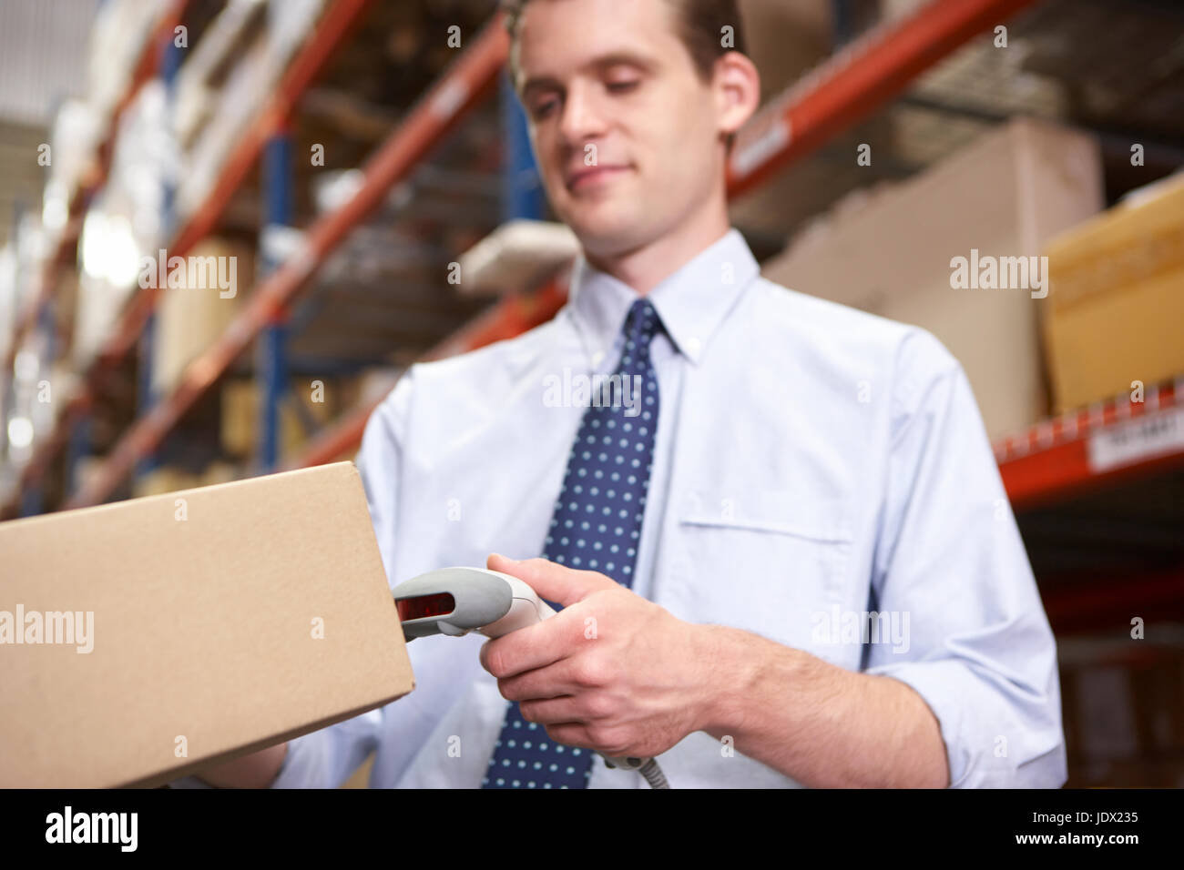 Businessman scanning shipping box in hi-res stock photography and ...