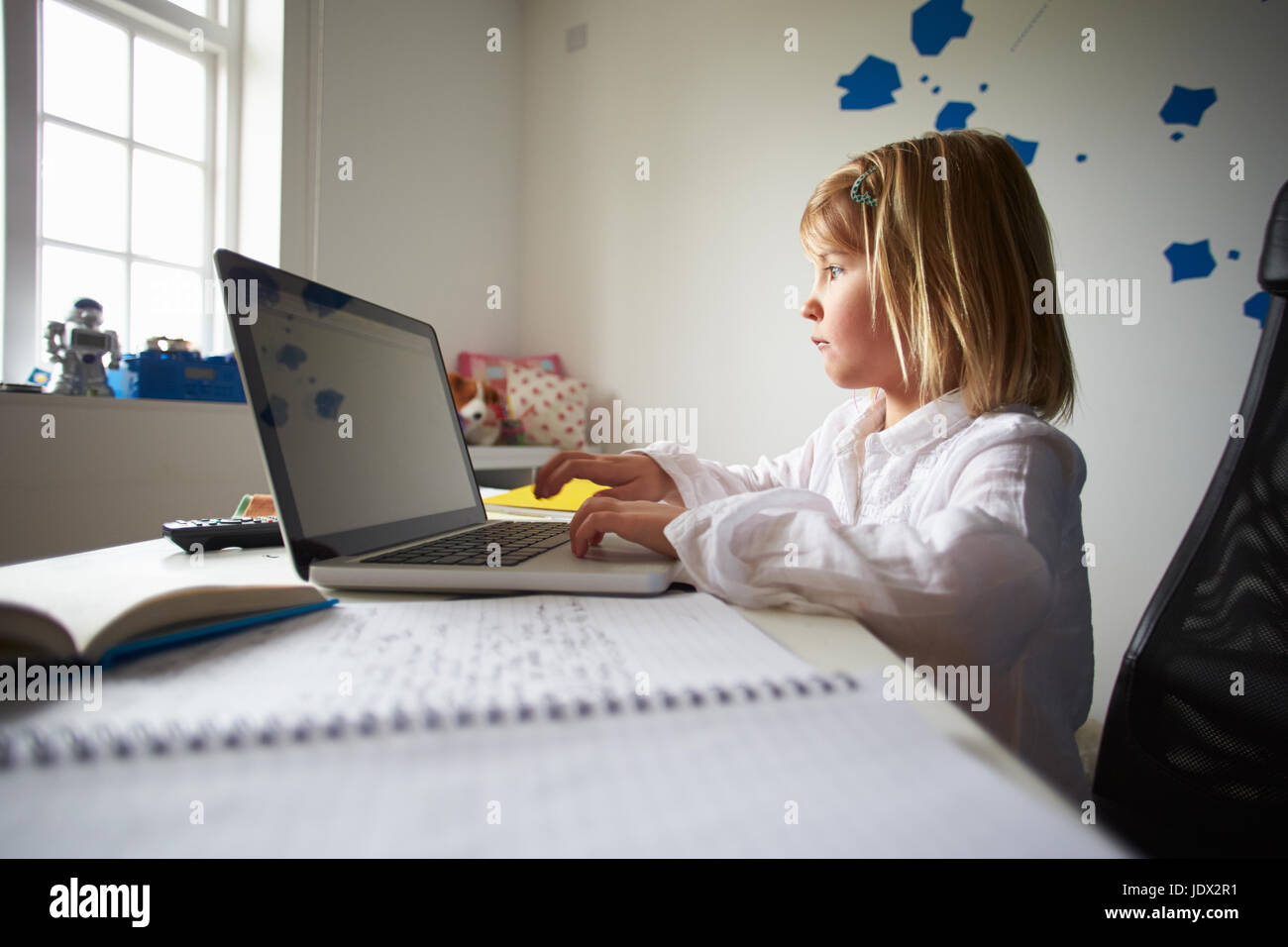 Girl Using Laptop In Bedroom Stock Photo - Alamy
