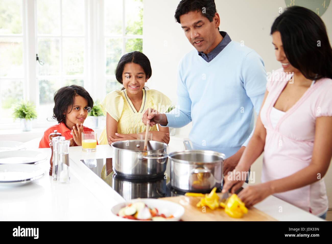 Indian Family Cooking Meal At Home Stock Photo - Alamy