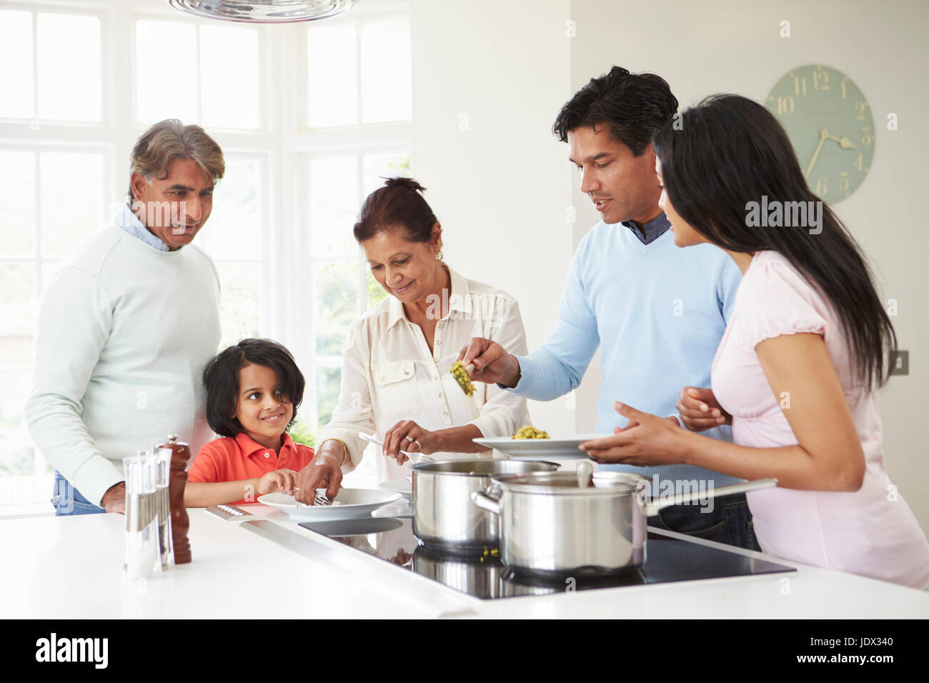 Multi Generation Indian Family Cooking Meal At Home Stock Photo - Alamy