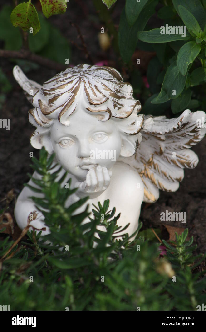 Little angel with flowers hi-res stock photography and images - Alamy