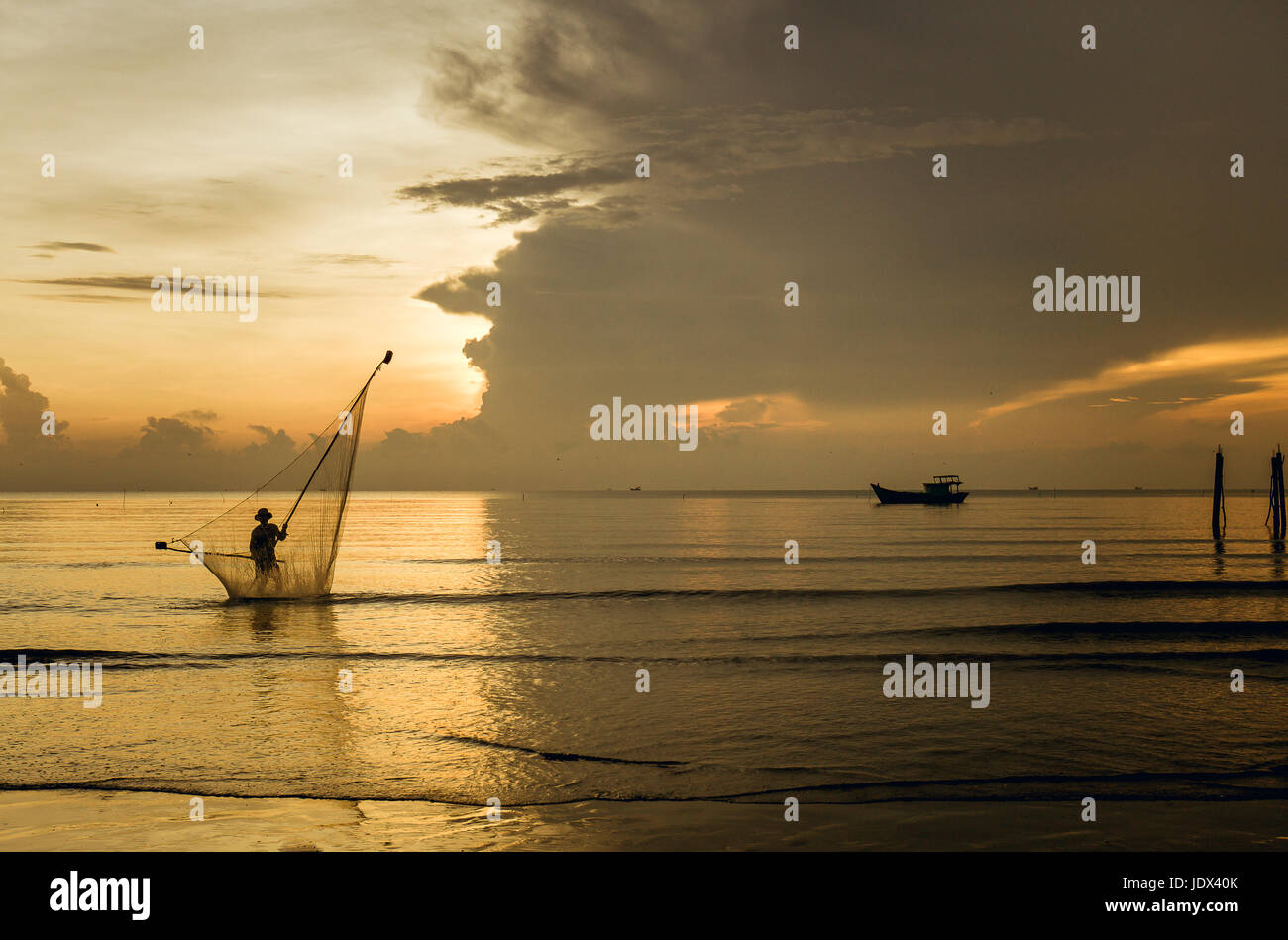 Sea clam digging fishermen golden sunrise Tan Thanh beach Go Cong Tien ...