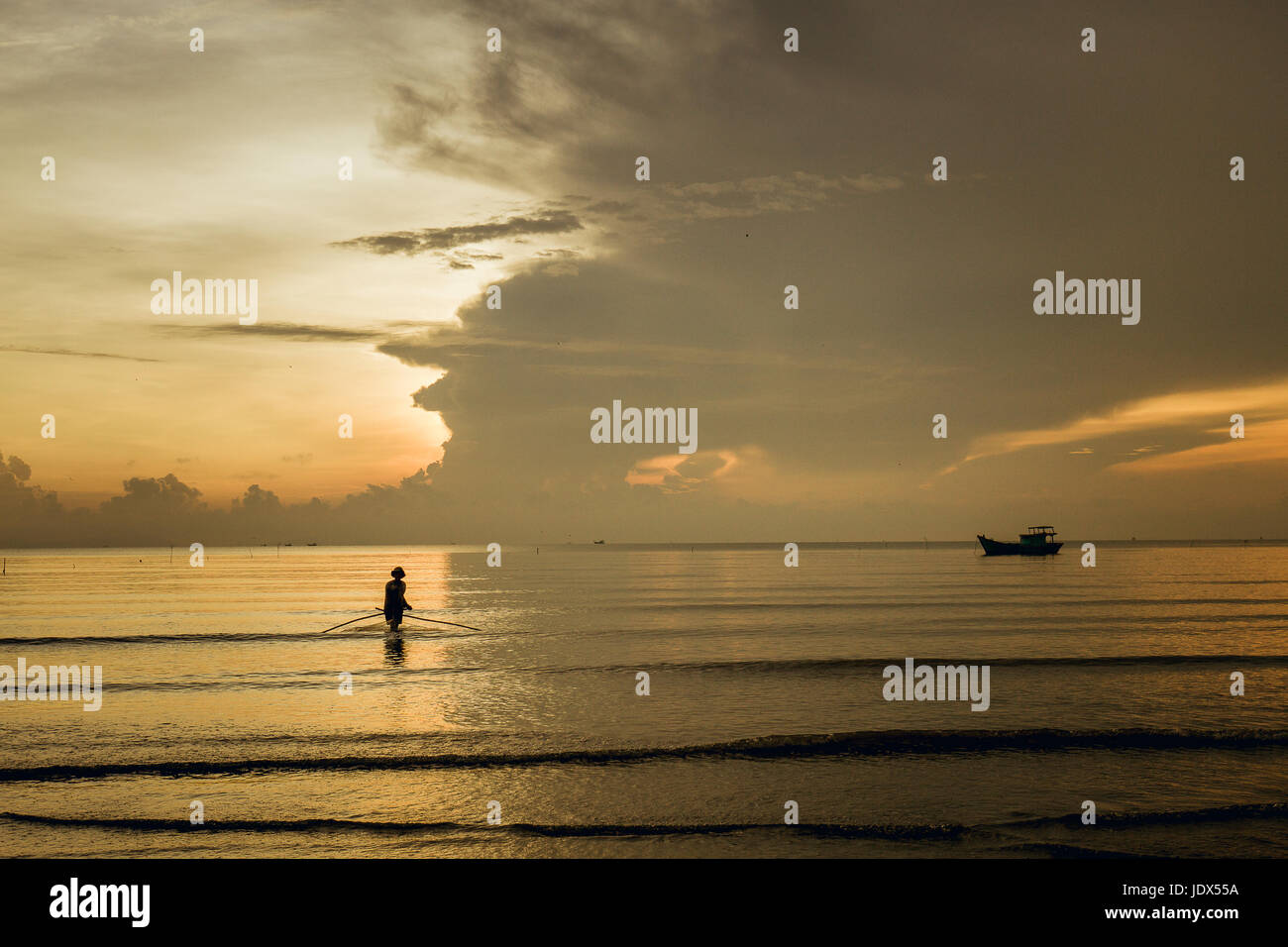 Sea clam digging fishermen golden sunrise Tan Thanh beach Go Cong Tien ...