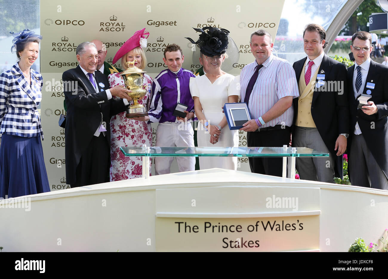 The Princess Royal (left) presents a trophy to the winning owners ...