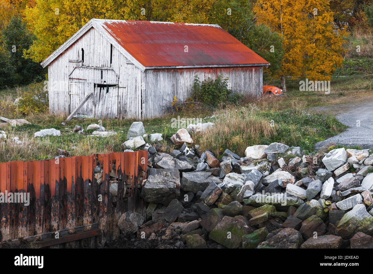 Traditional Norwegian wooden barn stands on the sea coast. Hasselvika ...