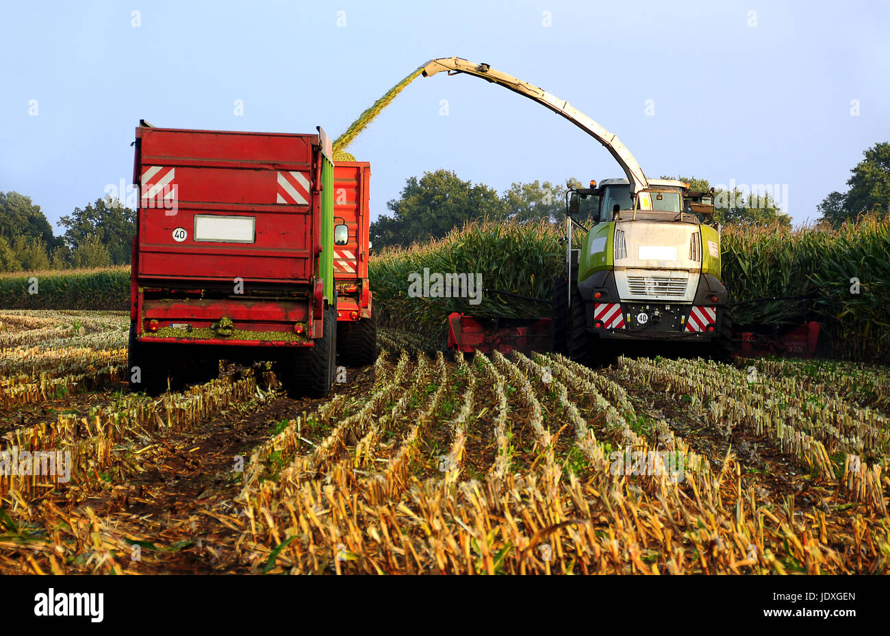 raw material combine harvester Stock Photo - Alamy