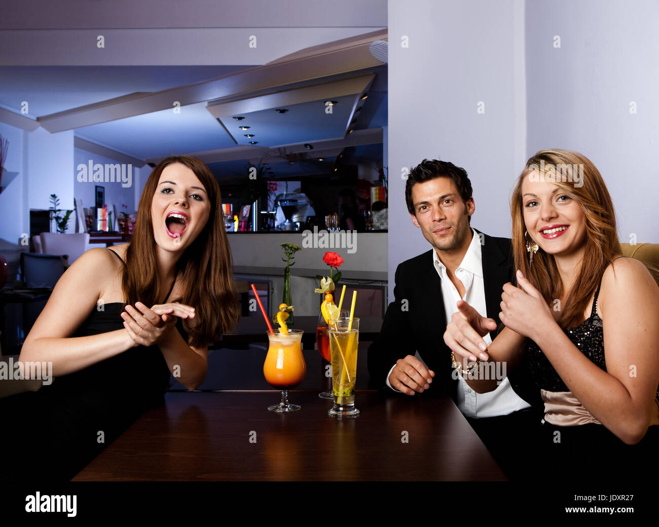 Young group of friends enjoying exciting show Stock Photo - Alamy