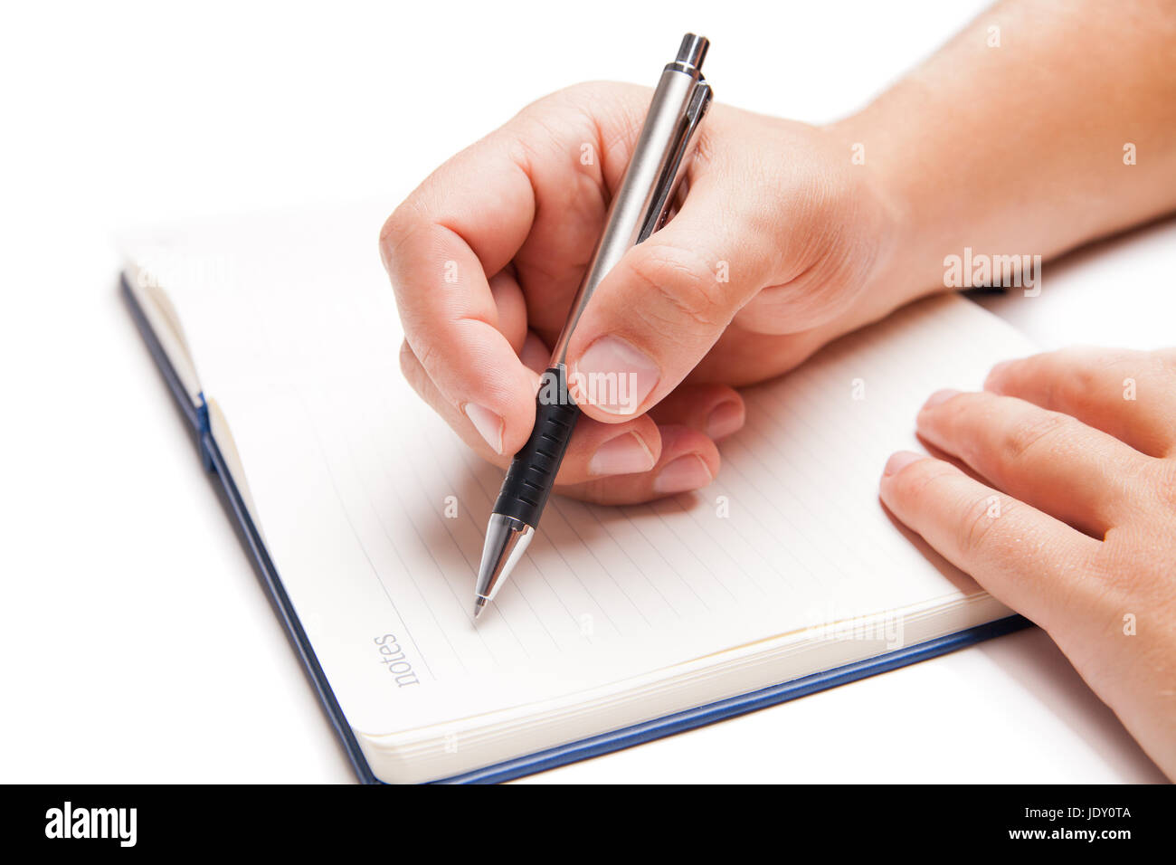 Man hand writing in open book isolated on white background Stock Photo ...