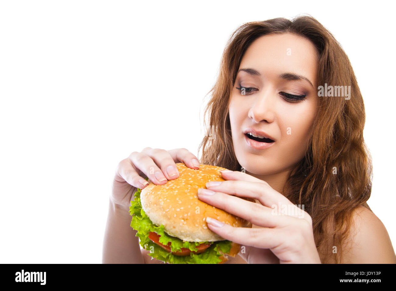 Happy Young Woman Eating big yummy Burger isolated on white background ...