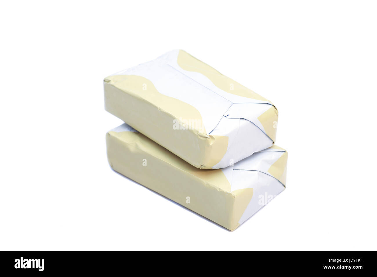 wrapped butter sticks isolated on white background Stock Photo - Alamy