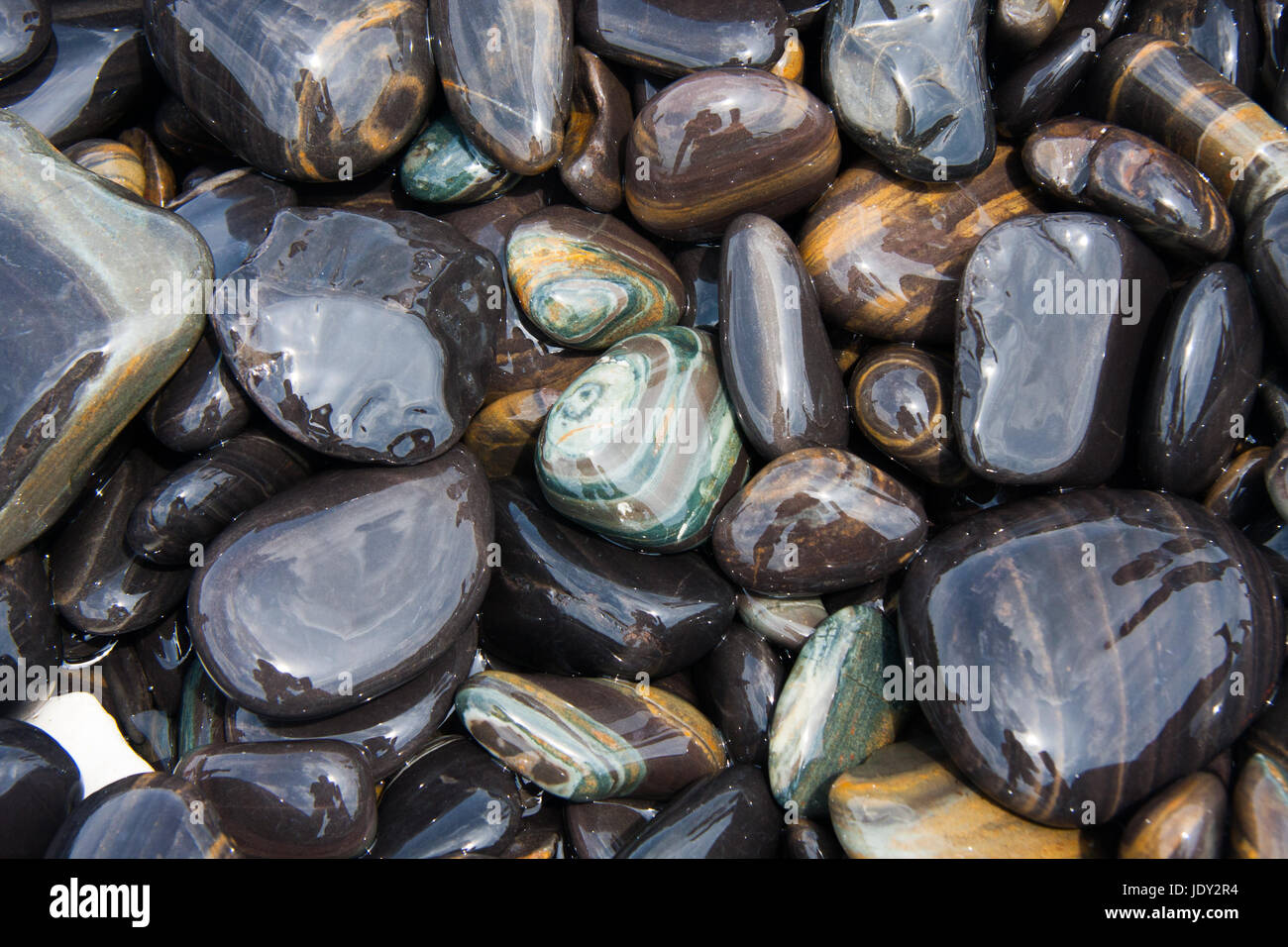 Shiny pebbles hi-res stock photography and images - Alamy