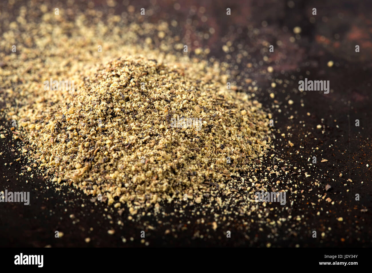Close - up Black pepper powder on a dark rusty background Stock Photo ...