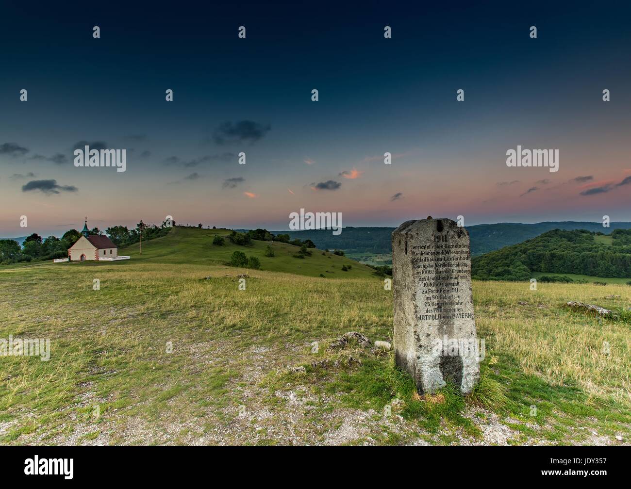 Evening landscape and a mile stone on the famous hill Walberla at the ...