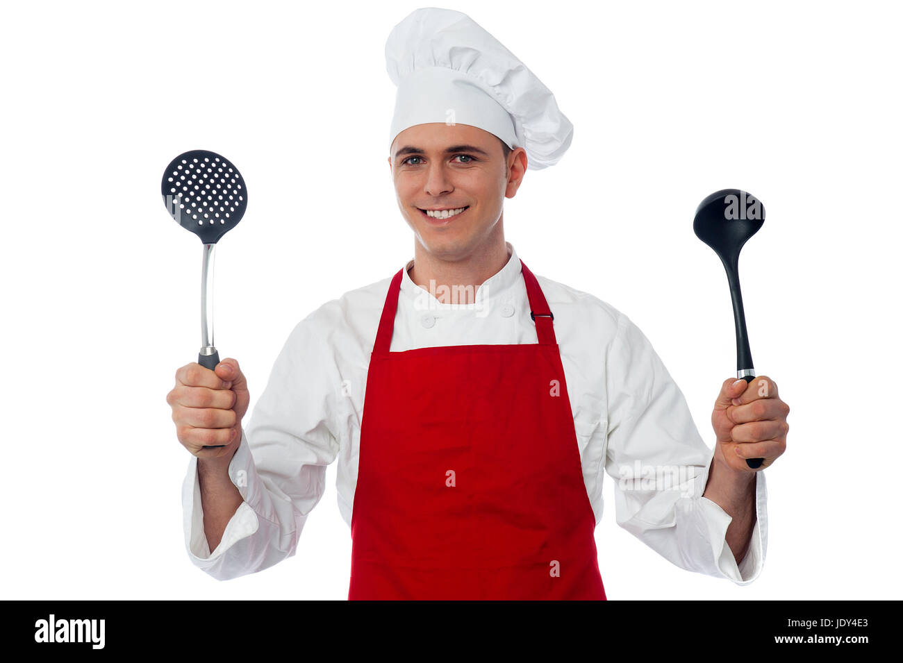 Smiling chef posing with ladle and skimmer Stock Photo - Alamy