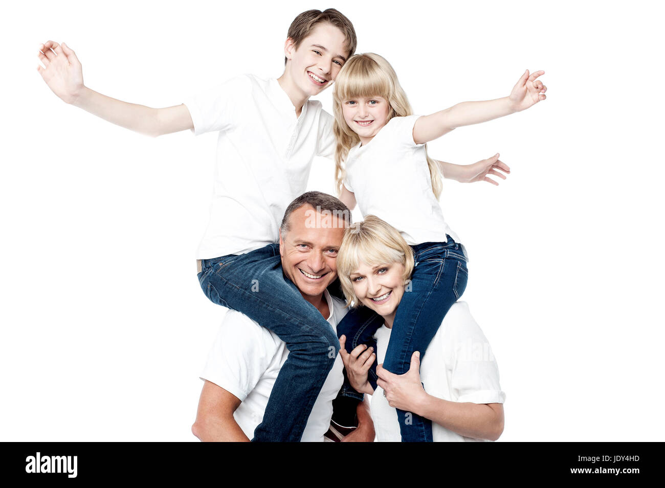 Loving parents carrying their children on shoulders Stock Photo - Alamy