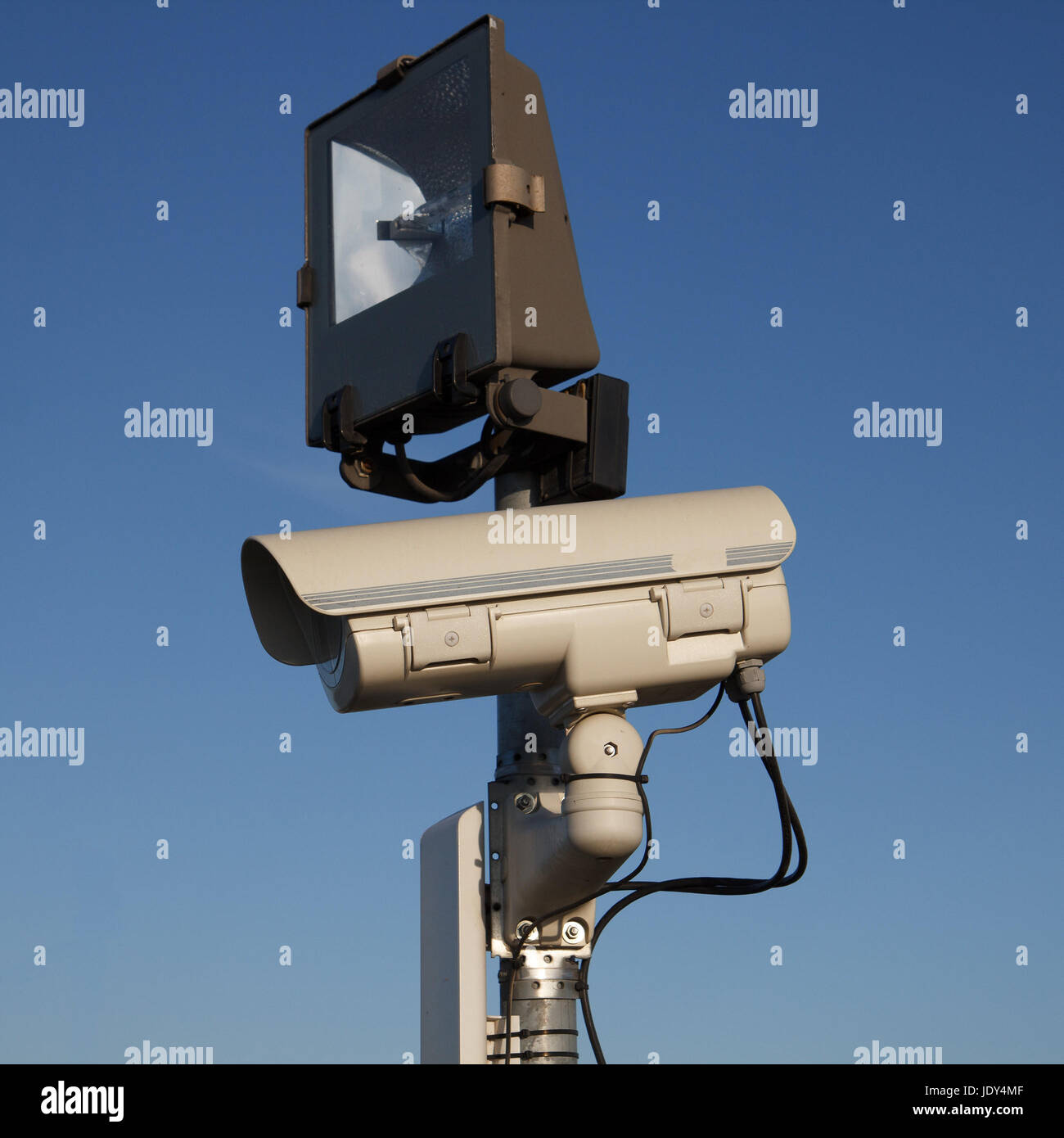 A gray security camera with a black light source Stock Photo - Alamy