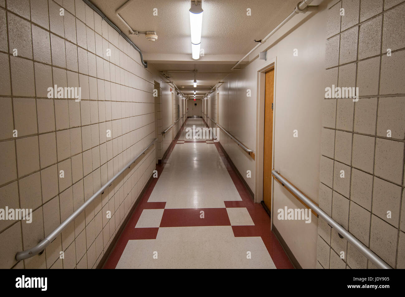 VIEW DOWN THE HALLWAY OF A SUBSIDIZED APARTMENT COMPLEX Stock Photo - Alamy