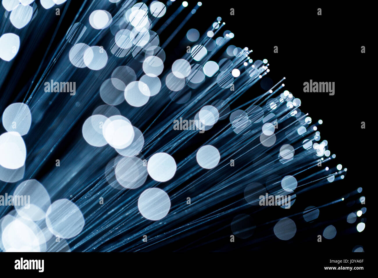 Fiber optic emitting blue light Stock Photo - Alamy