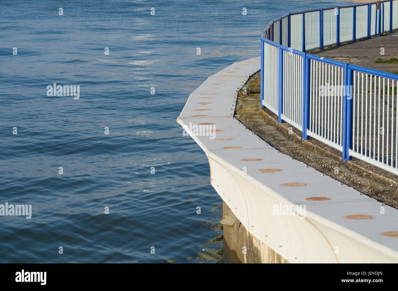 Steel Wave Protection and Railing with Calm Water Landscape Stock Photo ...