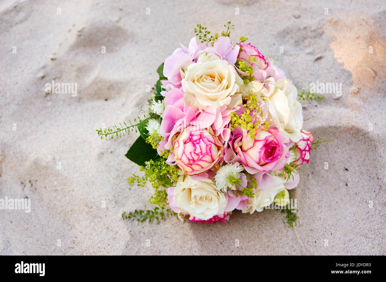 a bouquet of flowers on beach Stock Photo - Alamy