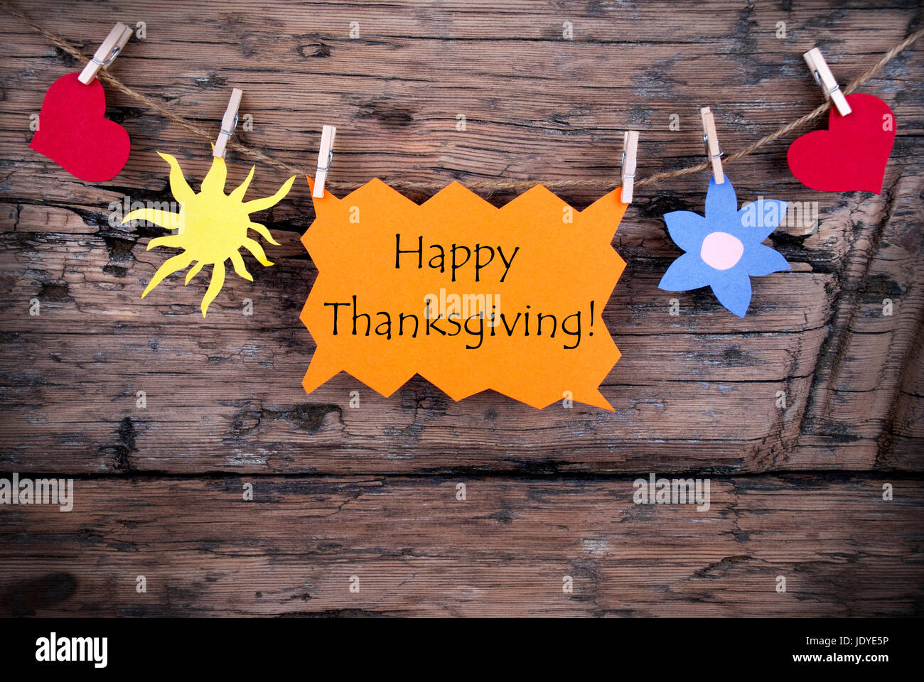 The Words Happy Thanksgiving on a Orange Banner Hanging on a Line with ...