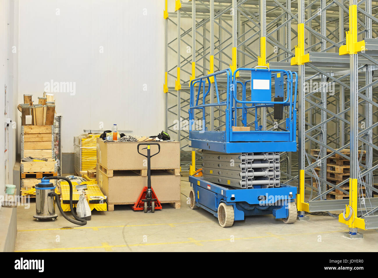 Scissor lift at construction site in distribution warehouse Stock Photo ...