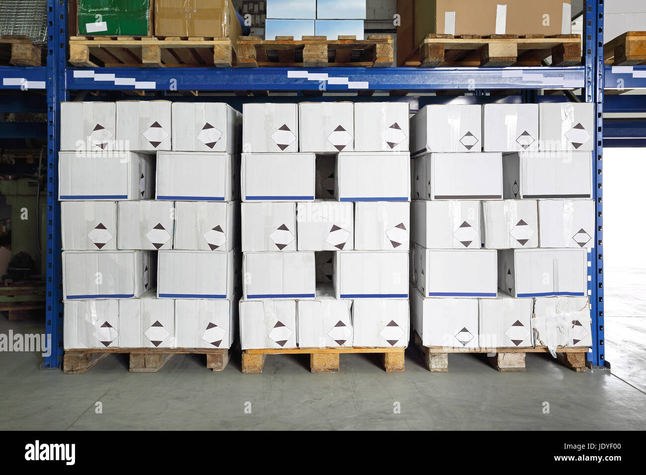 Boxes with goods at pallets in distribution warehouse Stock Photo - Alamy