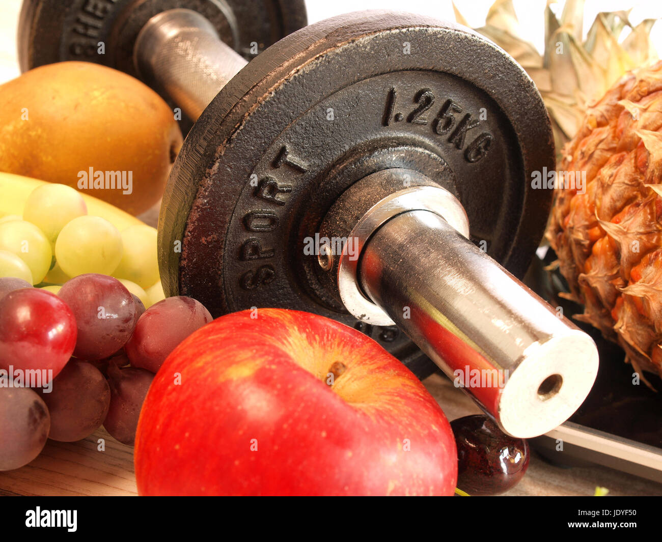 Fresh fruits with sports equipment Stock Photo - Alamy