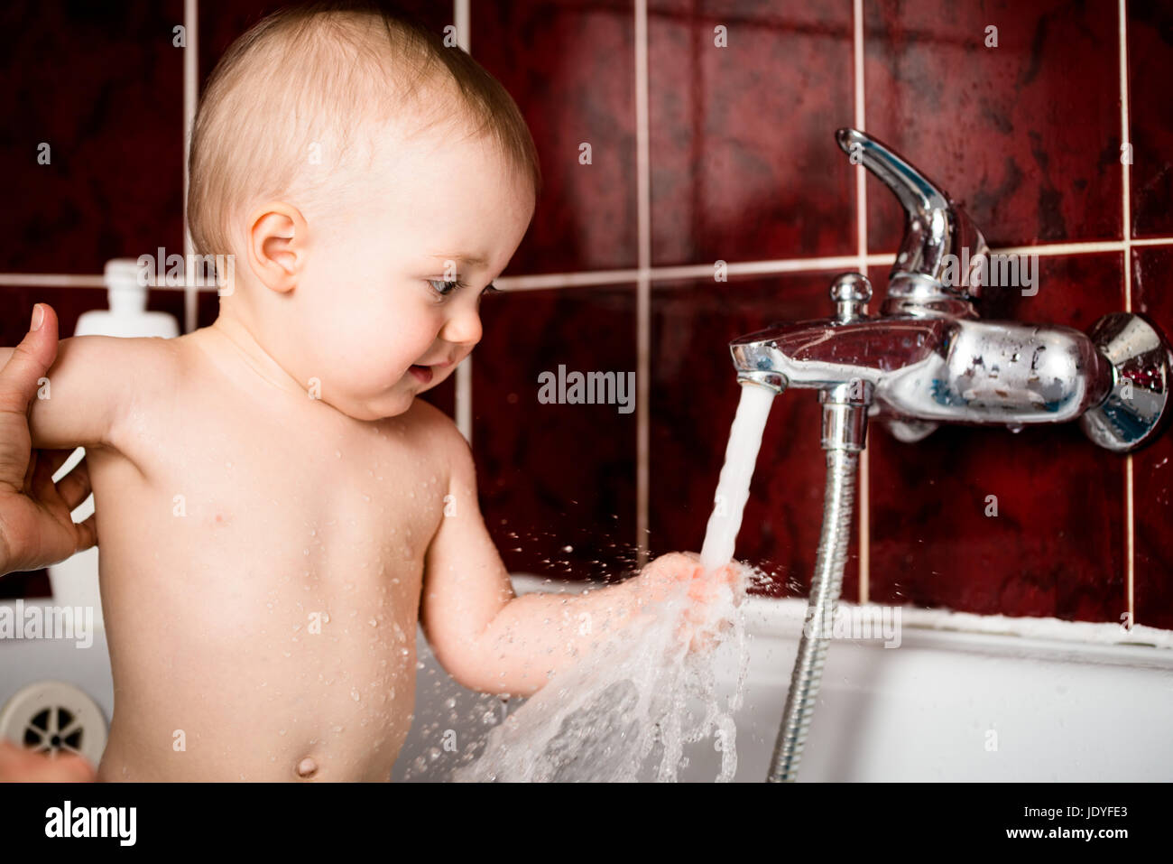 Baby water play tap hi-res stock photography and images - Alamy
