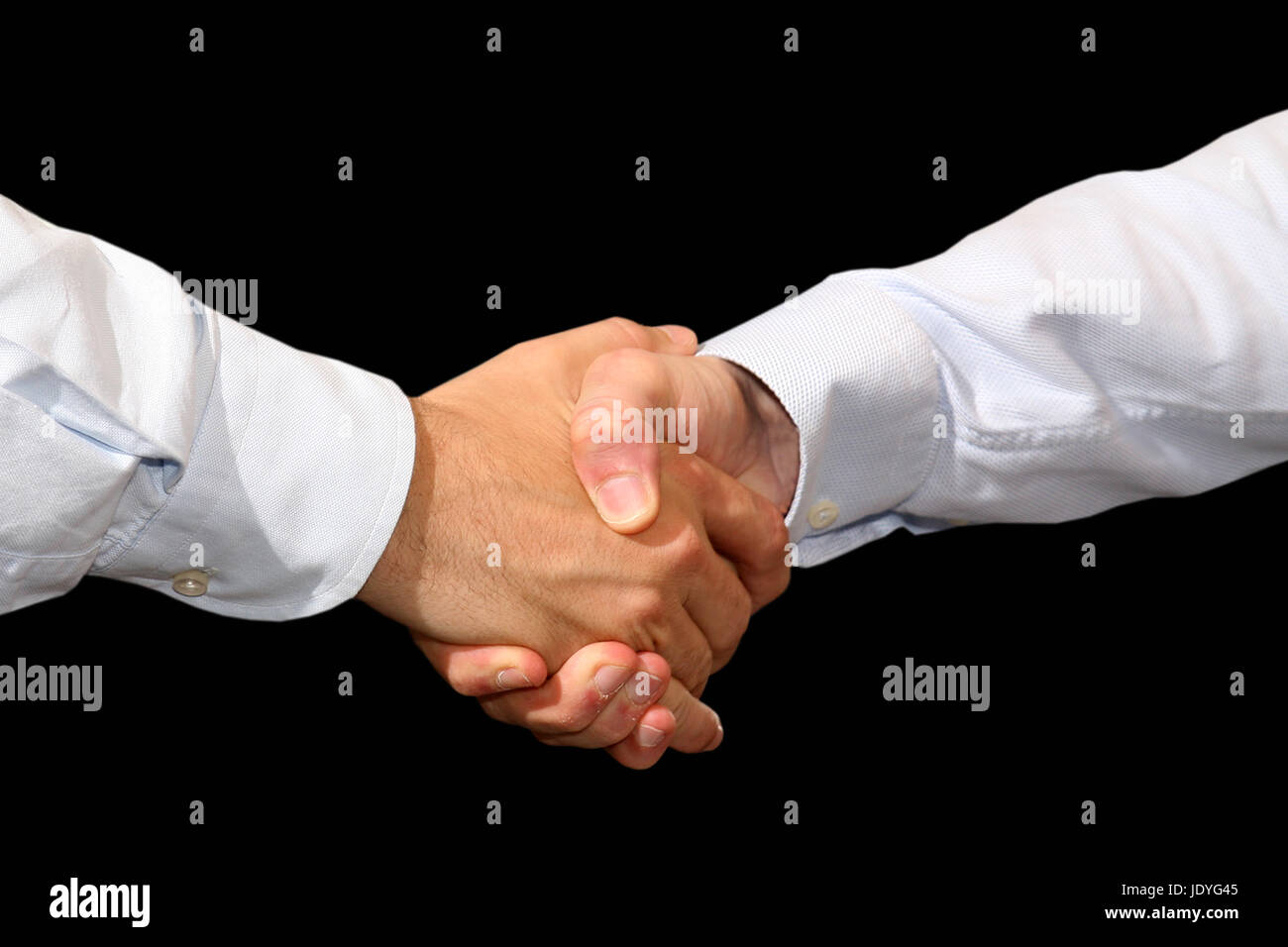 A business handshake on black background Stock Photo - Alamy