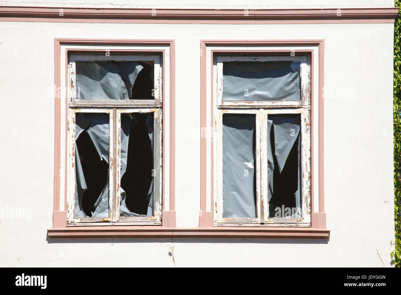 Old broken windows, condemned house Stock Photo - Alamy