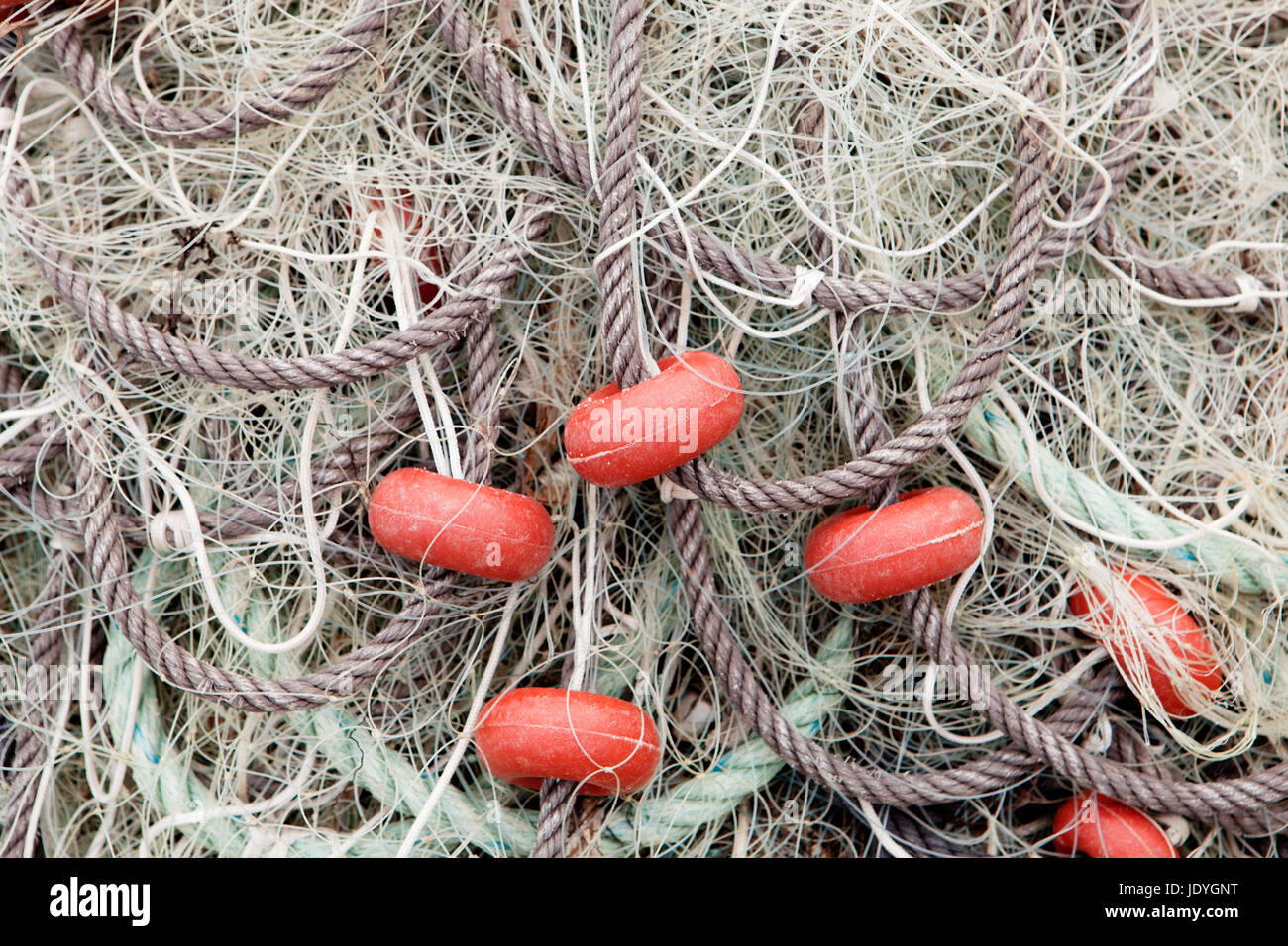 Detail of an old traditional fishing net Stock Photo - Alamy