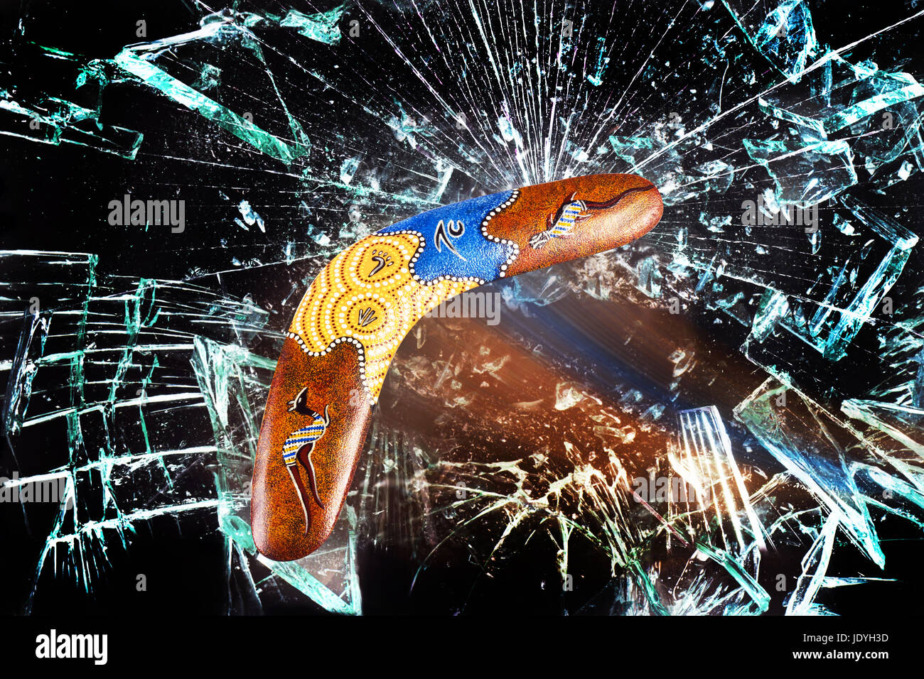 Boomerang flying fast through broken glass Stock Photo - Alamy