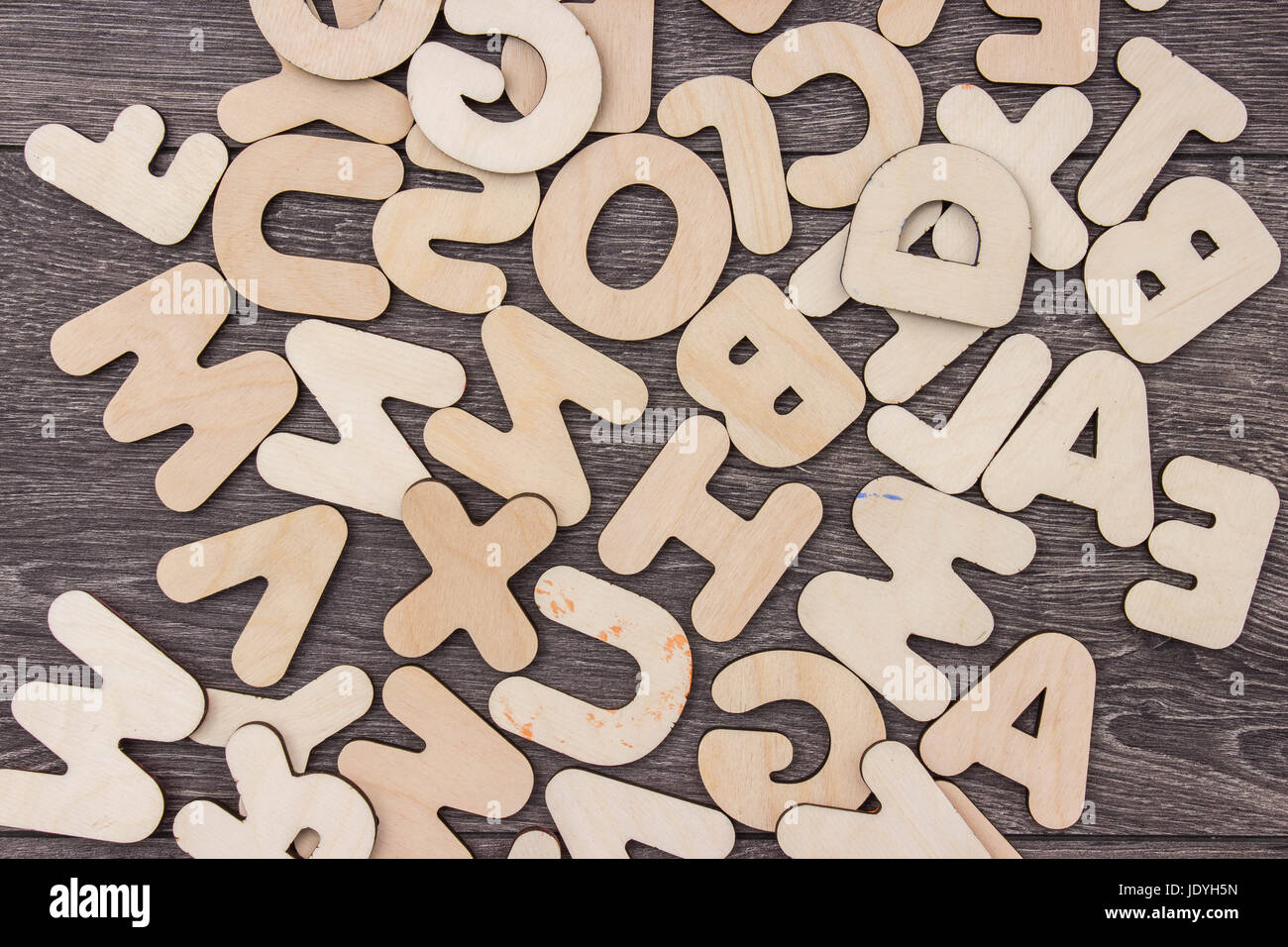Wooden letters on wooden board background Stock Photo - Alamy