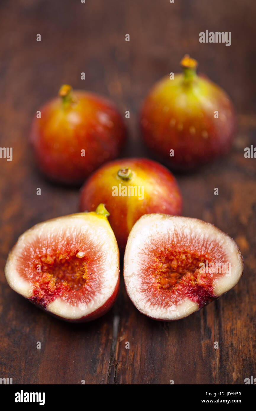 fresh figs macro closeup over old wood boards Stock Photo - Alamy