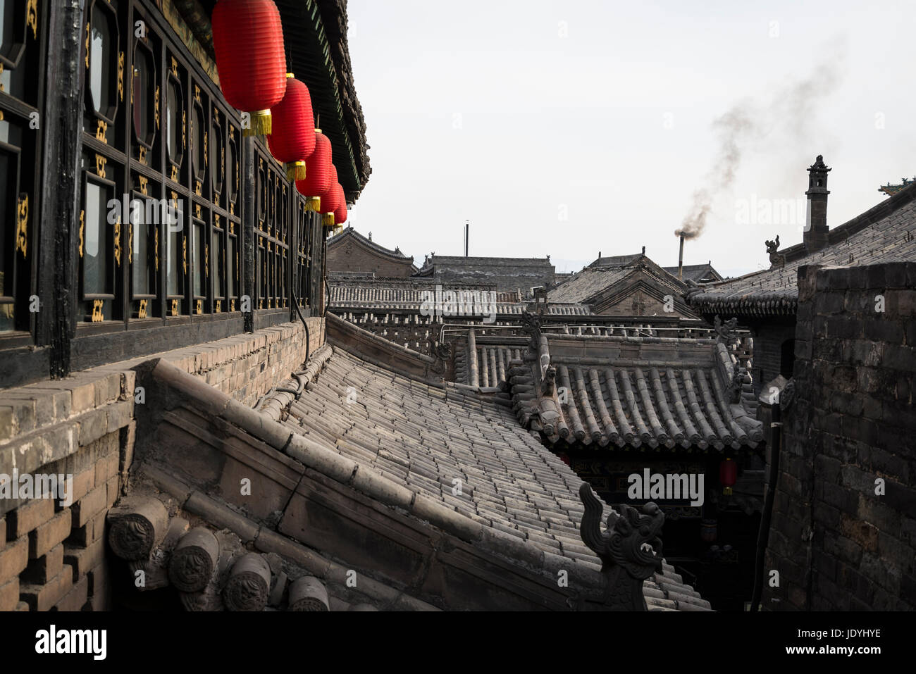 Smoking chimney over traditional rooftops, Tian Ji Xiang Museum ...