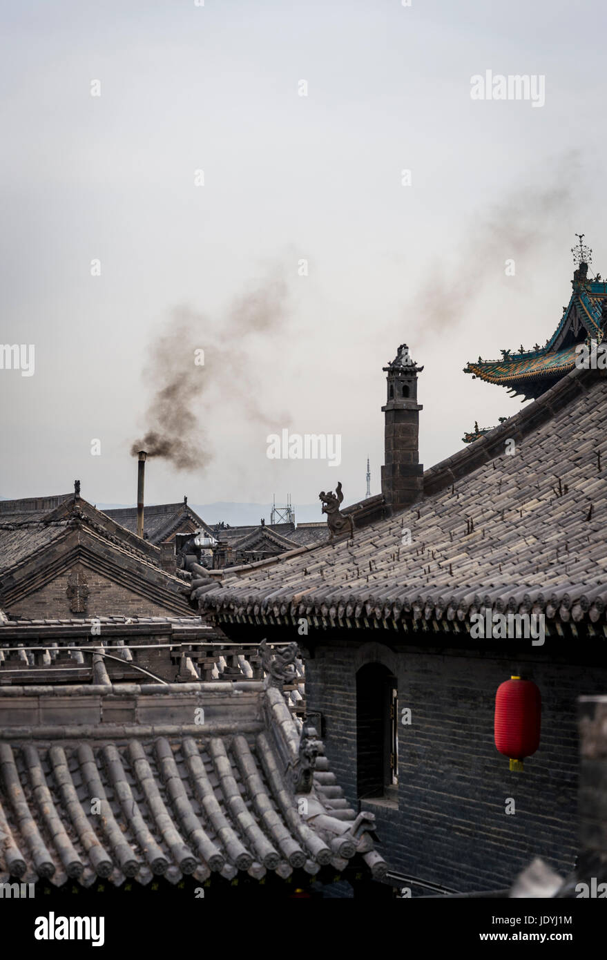 Smoking chimney over traditional rooftops, Tian Ji Xiang Museum ...